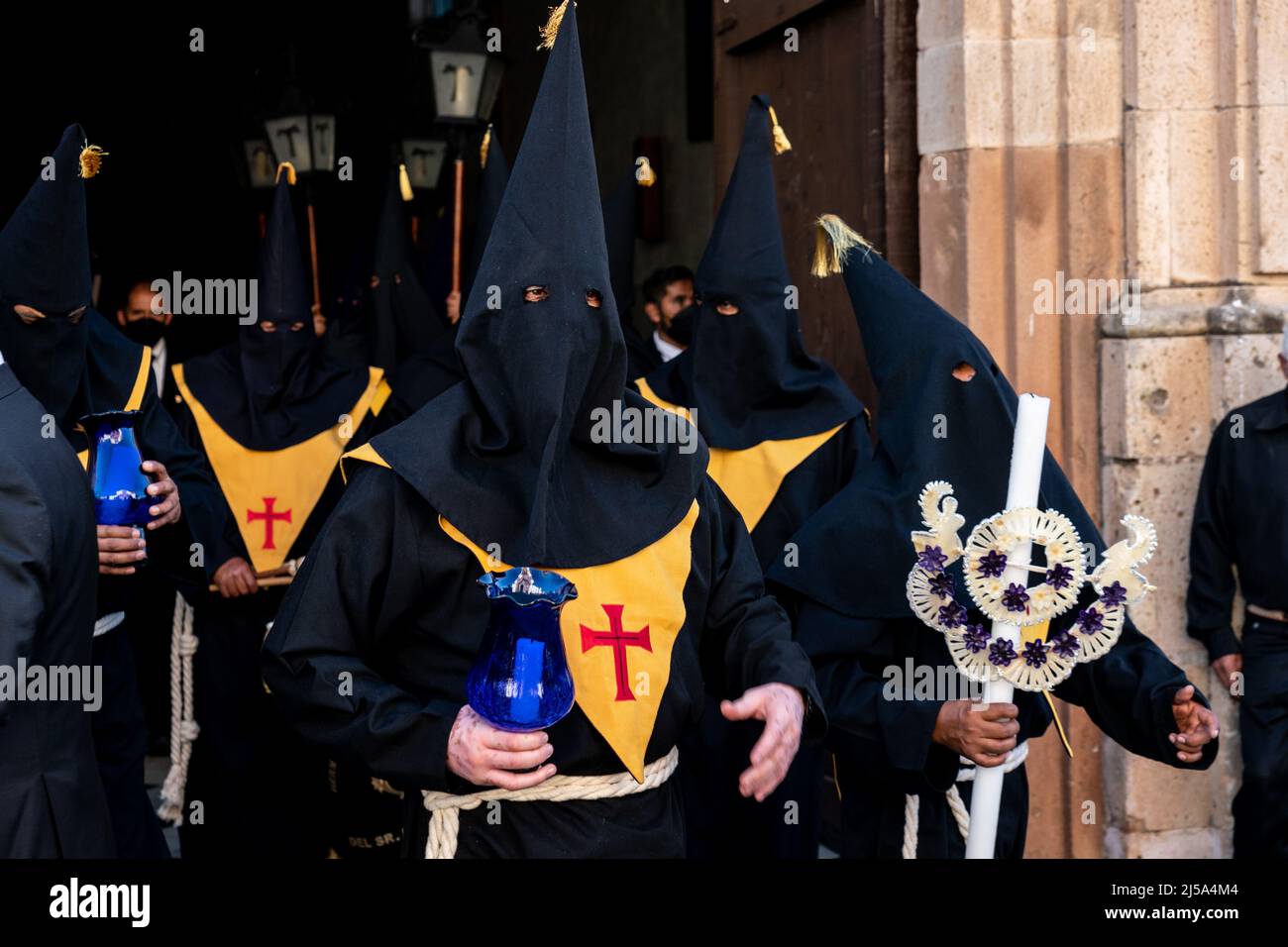 Roman Catholic hooded penitents wearing traditional capirotes, began ...
