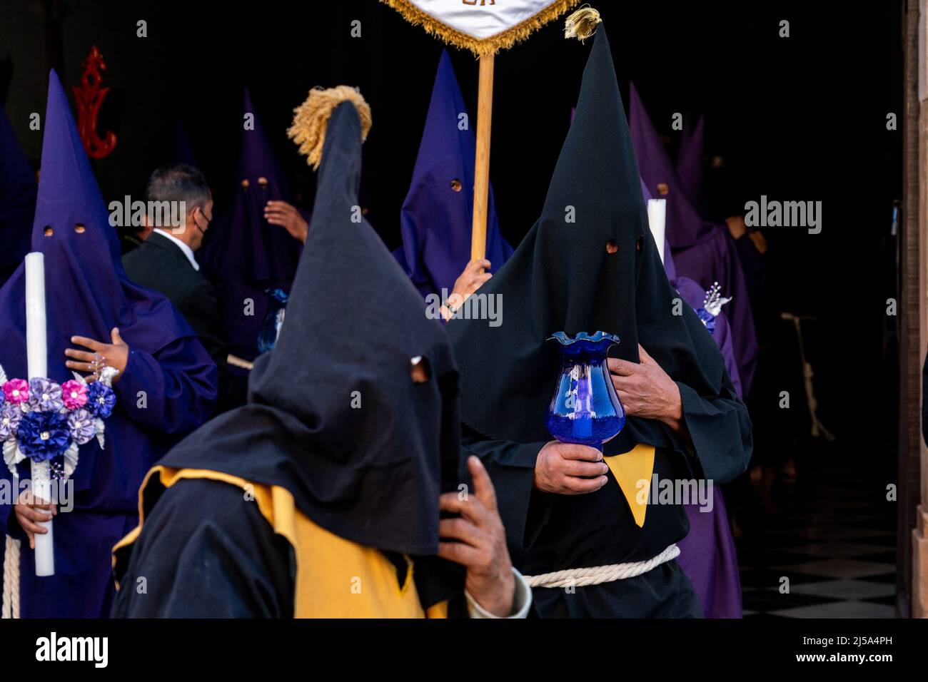 Roman Catholic hooded penitents wearing traditional capirotes, began ...