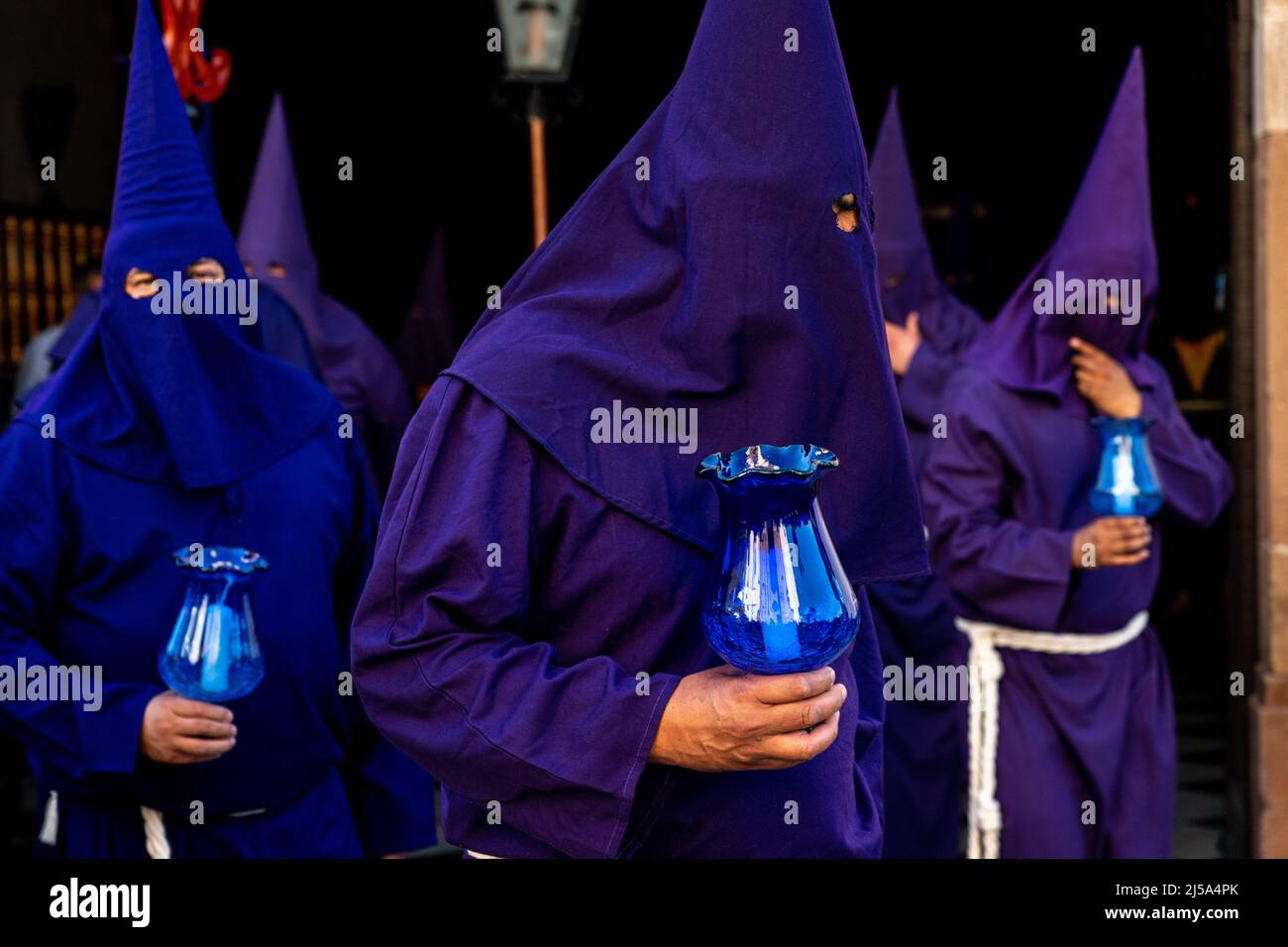 Roman Catholic hooded penitents wearing traditional capirotes, began ...
