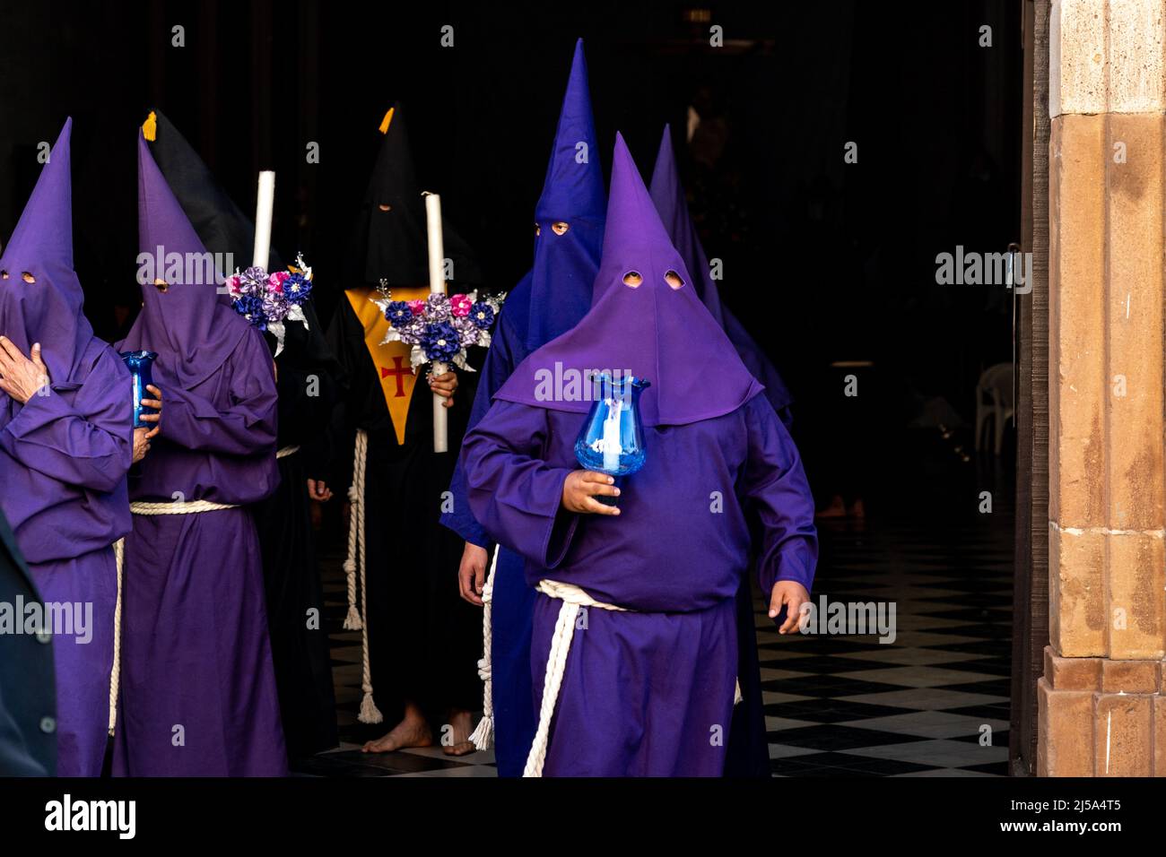 Roman Catholic hooded penitents wearing traditional capirotes, began ...