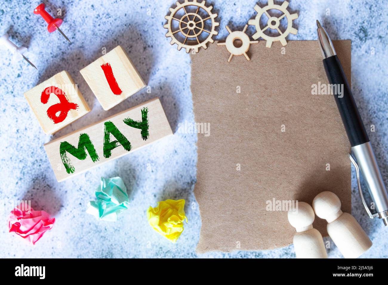 wooden calendar with date 21 May and easel on blue background, place ...