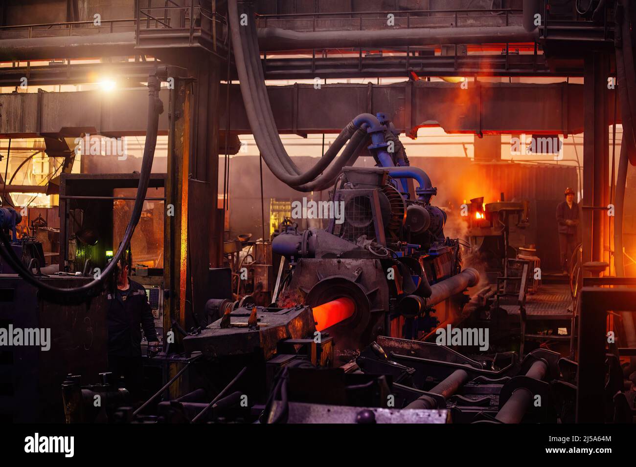 Process of Iron pipe casting at the foundry Stock Photo - Alamy