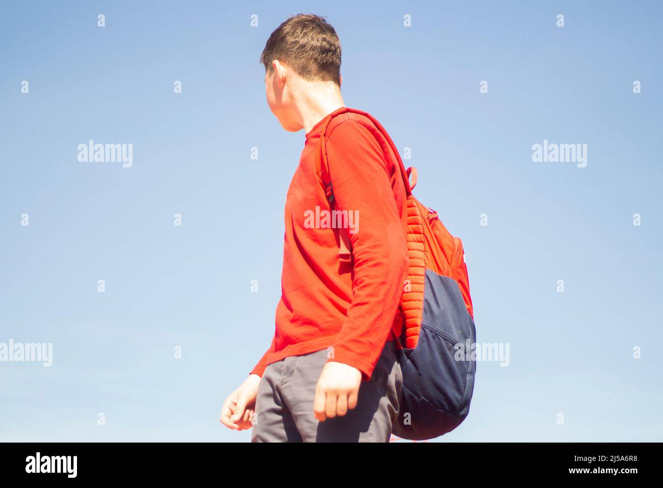 The guy with the backpack. The man looks behind the back. A guy in ...