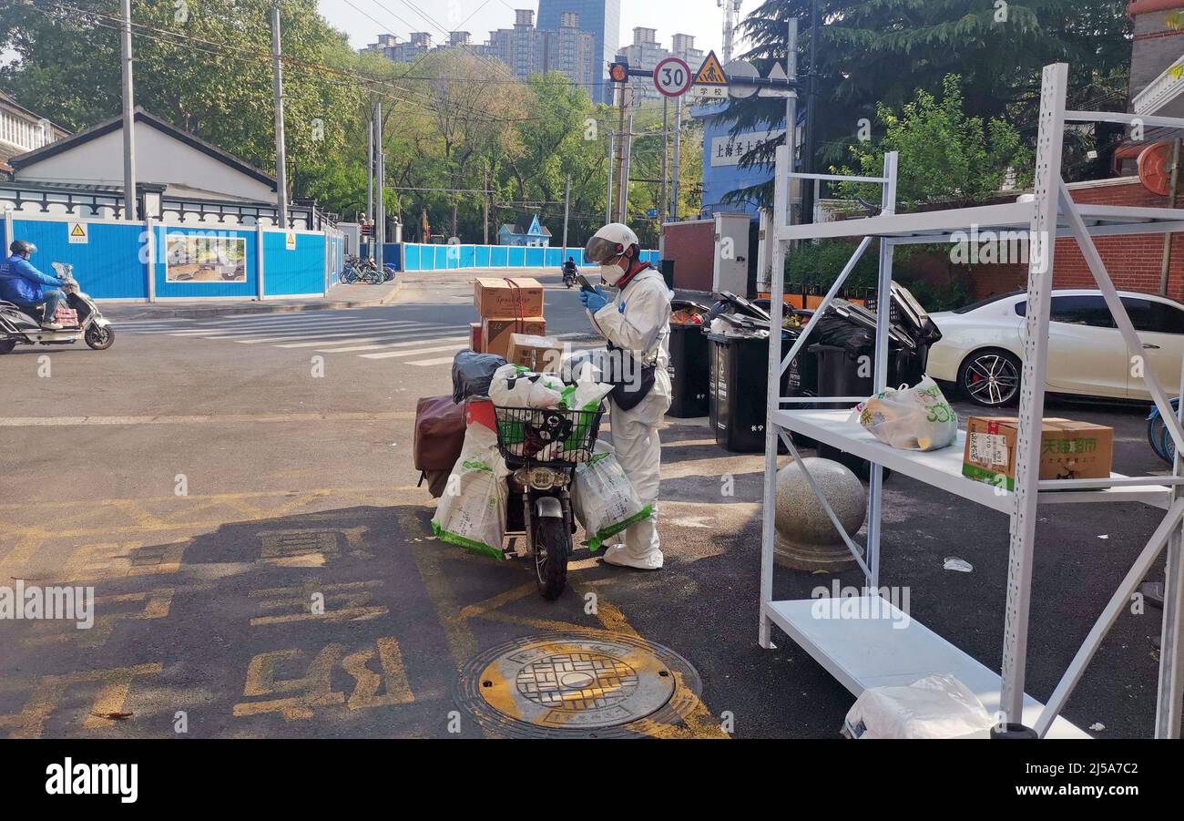 SHANGHAI, CHINA - APRIL 21, 2022 - Deliverymen work with community ...