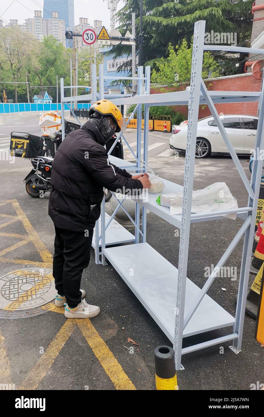 China. 22nd Apr, 2022. SHANGHAI, CHINA - APRIL 21, 2022 - Deliverymen ...