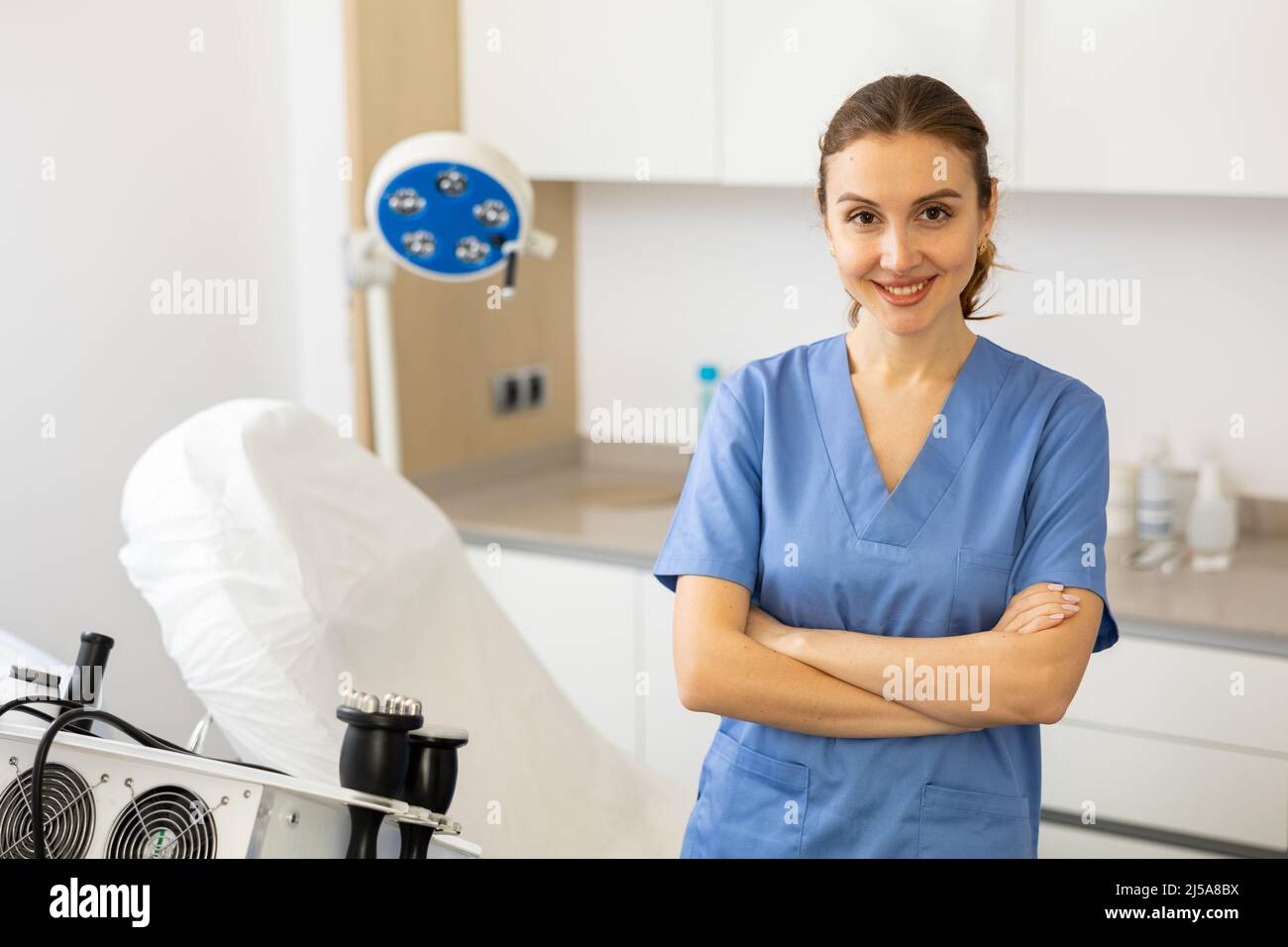 Female cosmetician welcoming to cosmetology clinic Stock Photo - Alamy