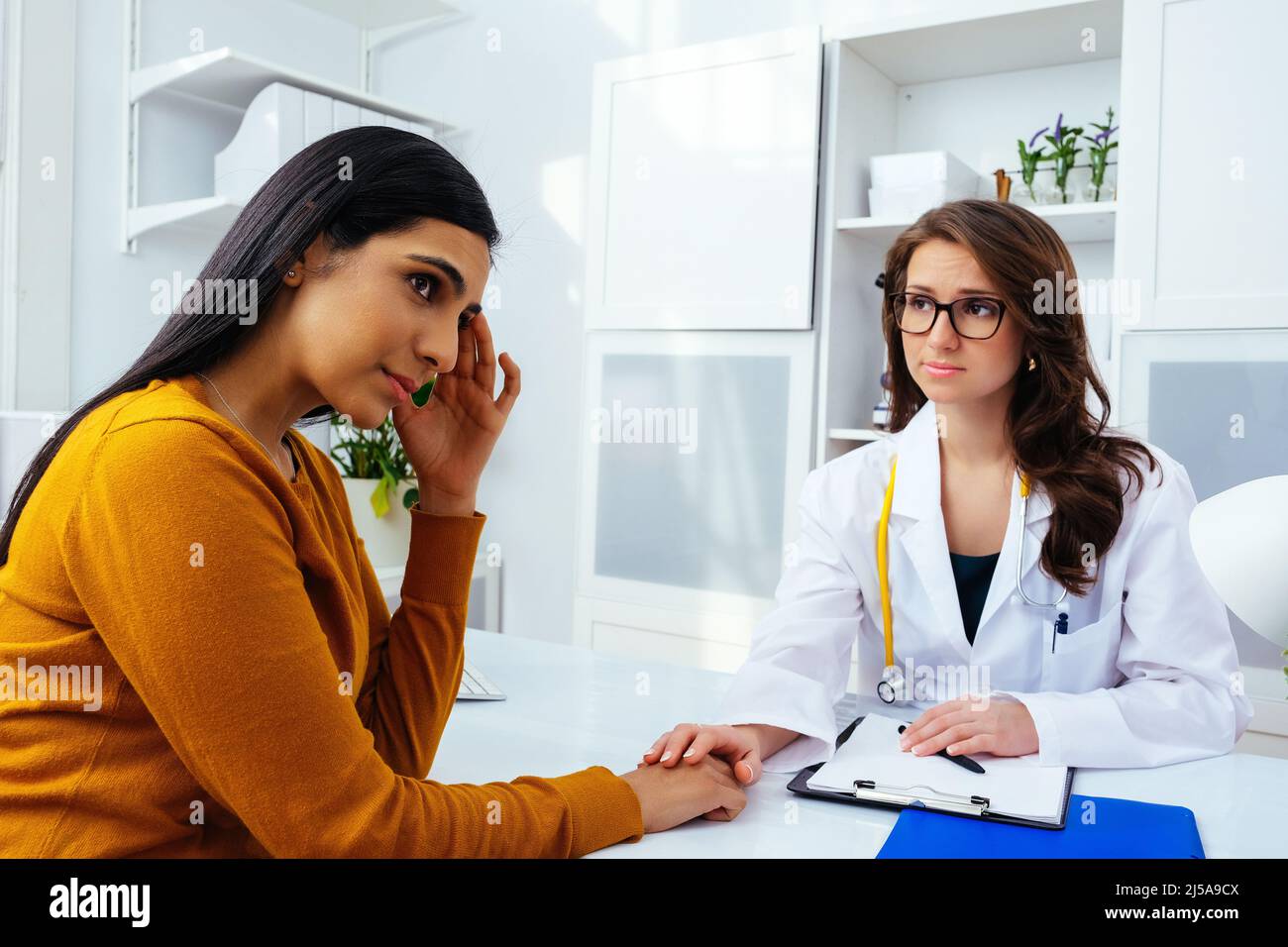 female doctor talking with her patient in hospital healthcare industry ...