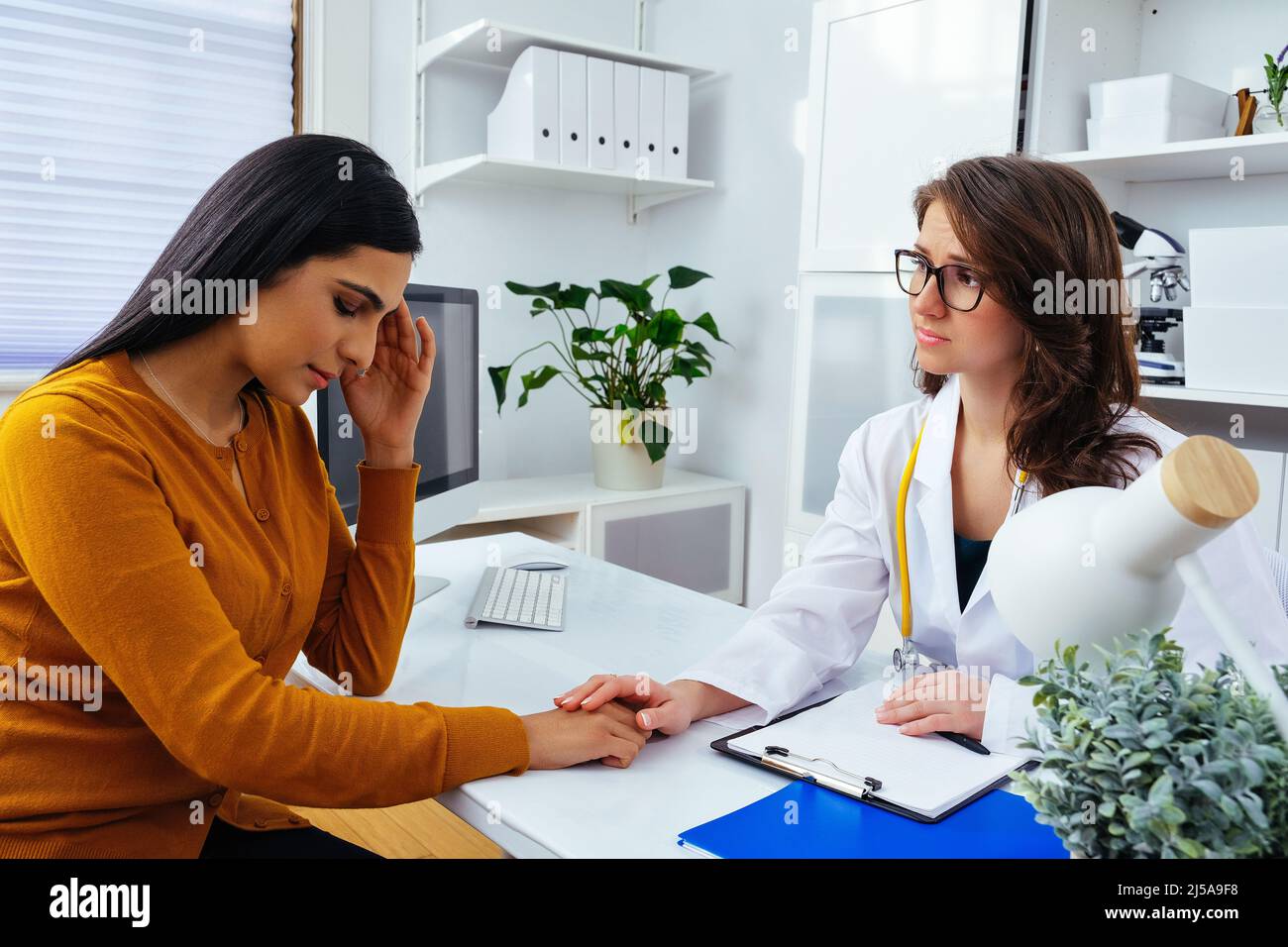 female doctor talking with her patient in hospital healthcare industry ...