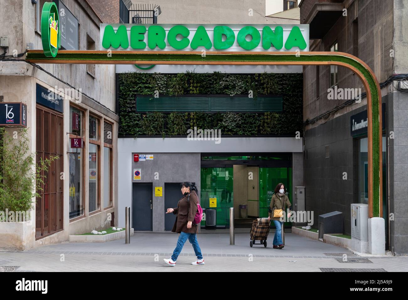 Madrid, Spain. 19th Mar, 2022. A pedestrian walks past the Spanish ...