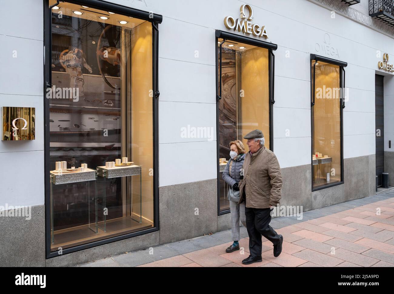 Madrid, Spain. 20th Mar, 2022. Pedestrians walk past the Swiss luxury ...
