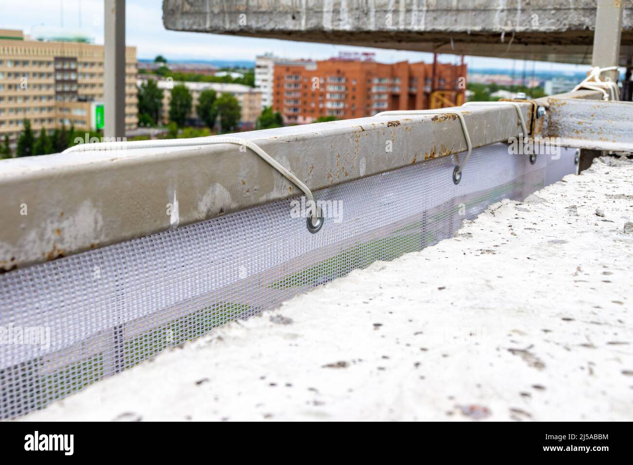 facade protective mesh stretched over a steel frame for fencing ...