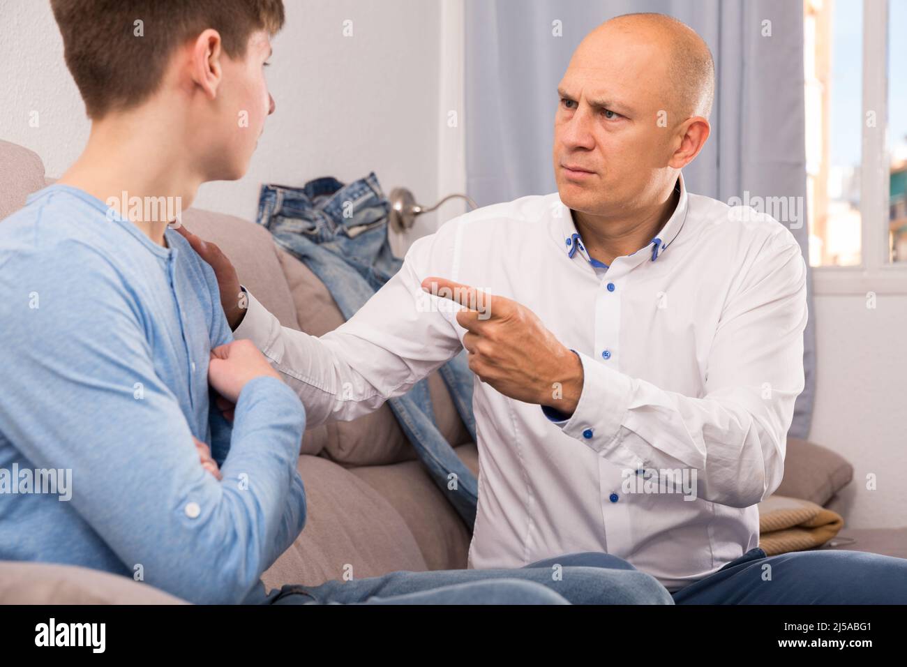 Father lecturing son hi-res stock photography and images - Alamy