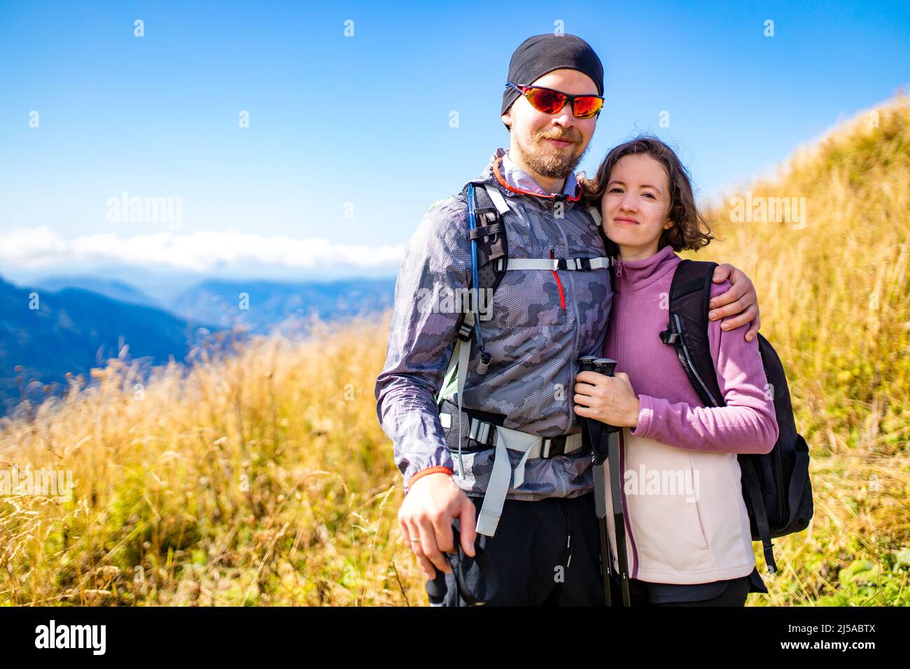 newwed couple hikers trekking in mountains in wedding honey moon Stock ...