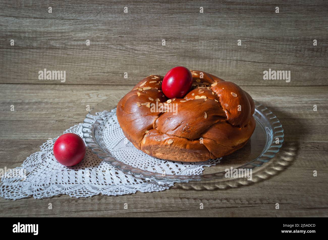 Easter traditional bread, greek tsoureki and red eggs Stock Photo - Alamy