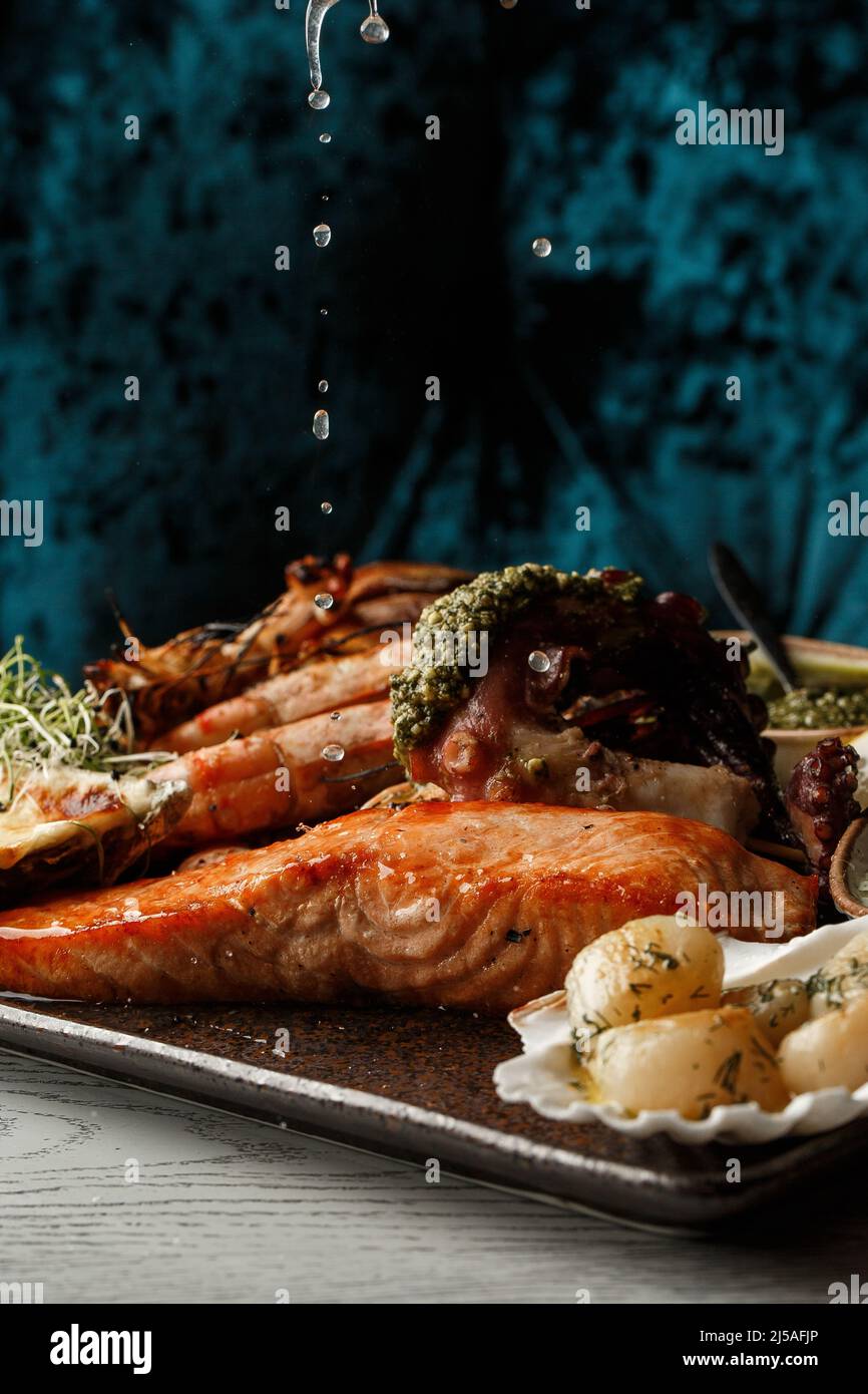 Roasted Mixed Seafood Contain Mussels, prawns, salmon, Calamari Squids ...