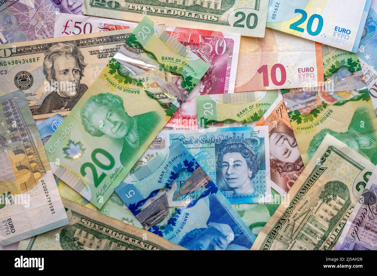 Calgary, Alberta - April 21, 2022: Background with multiple currencies ...