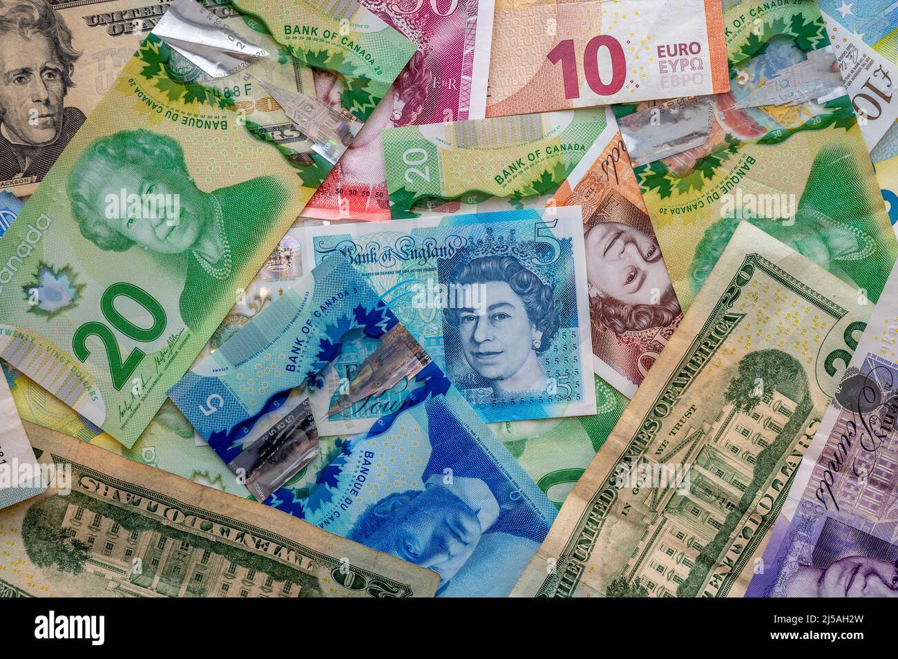 Calgary, Alberta - April 21, 2022: Background with multiple currencies ...