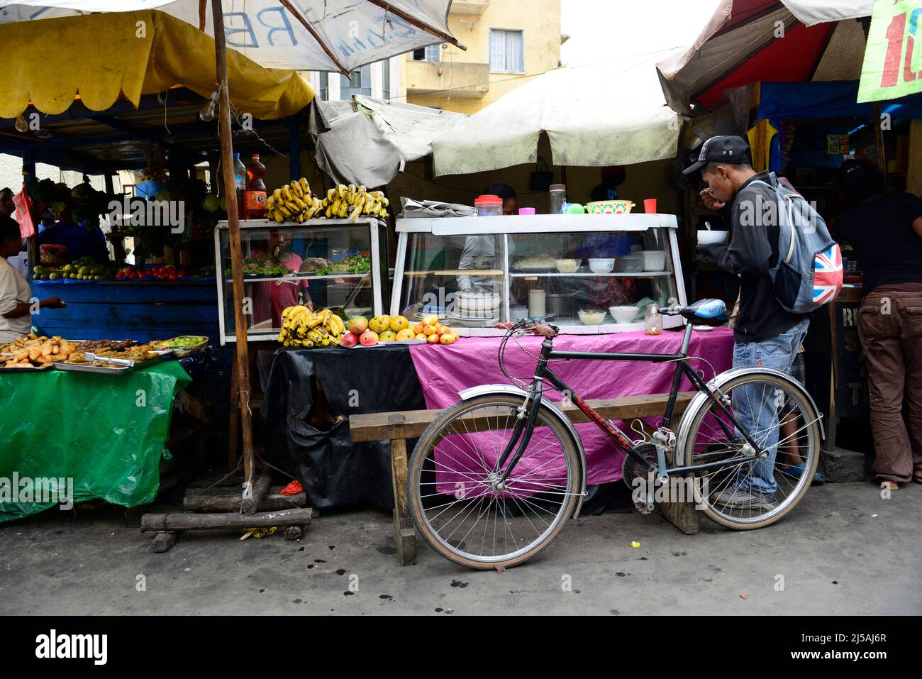 Malagasy street food vendor in the center of Antananarivo, Madagascar ...