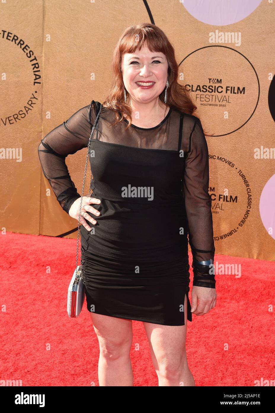 Aileen Quinn walking on the red carpet at the 2022 TCM Classic Film ...