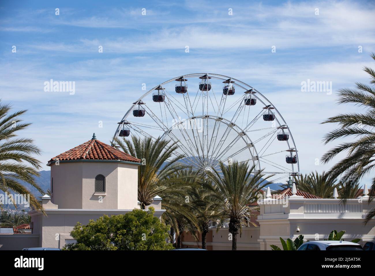Daytime palm framed view of the Orange County downtown skyline of ...