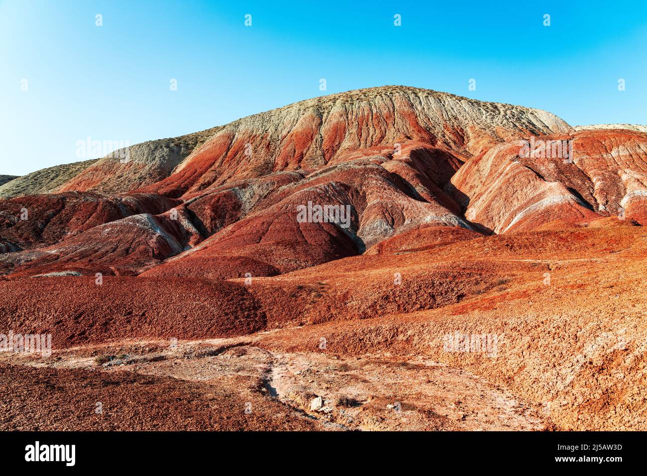 Red sand mountains in the desert area Stock Photo - Alamy