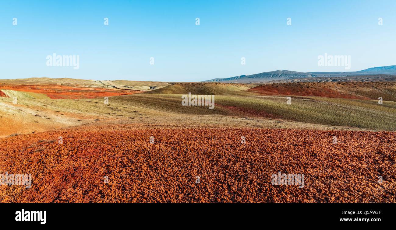 Red sand mountains in the desert area Stock Photo - Alamy
