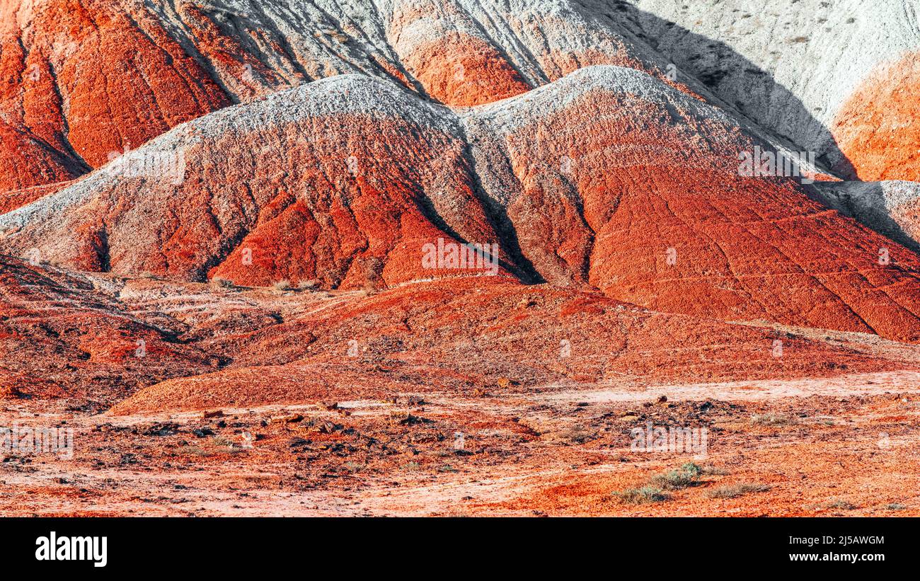 Red sand mountains in the desert area Stock Photo - Alamy