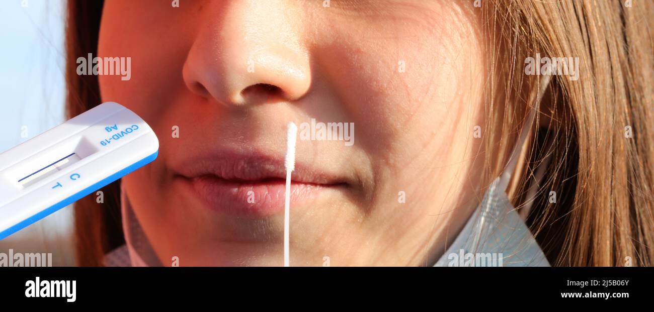 nasal swab and the young schoolgirl during the test to diagnose Covid ...