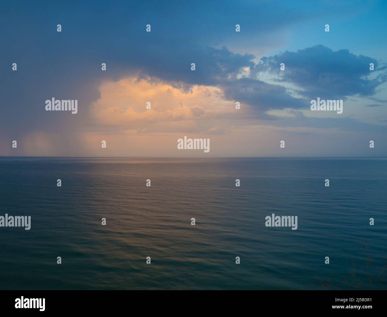 landscape with cloudy sky and ripples at sea Stock Photo - Alamy