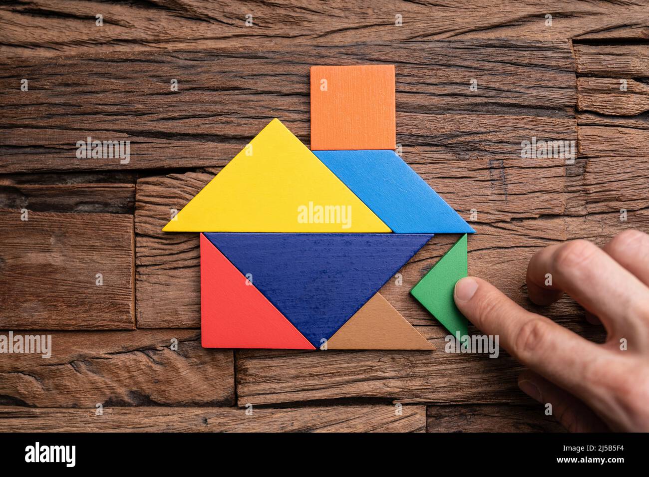 Miniature House Puzzle Pieces And Tangram. Wooden Toy Real Estate Stock ...