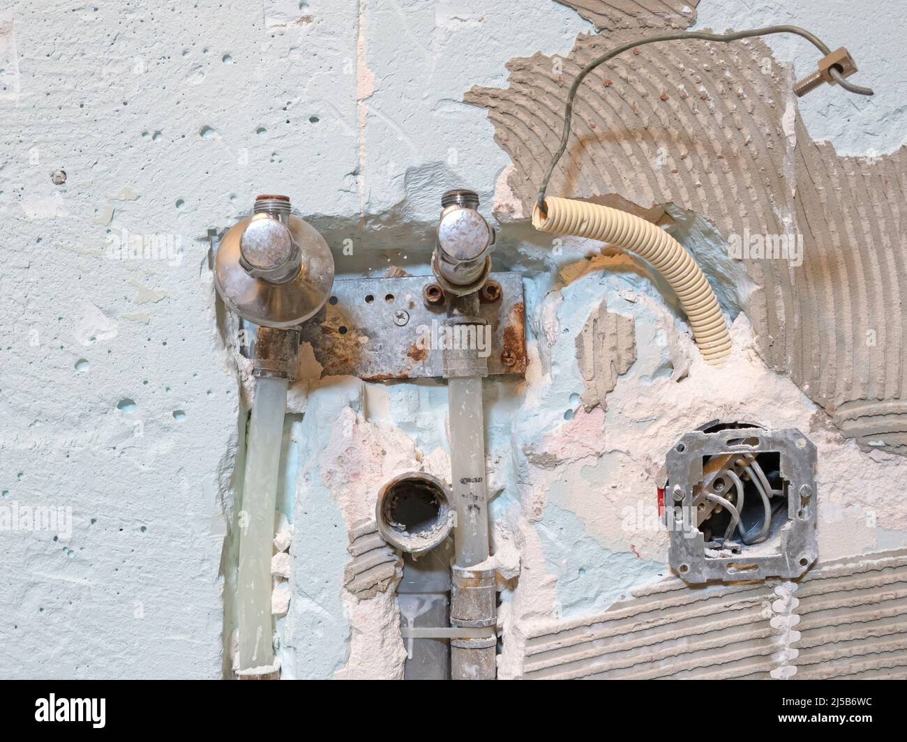 Drain pipe and water pipes in a plaster wall, under construction Stock ...