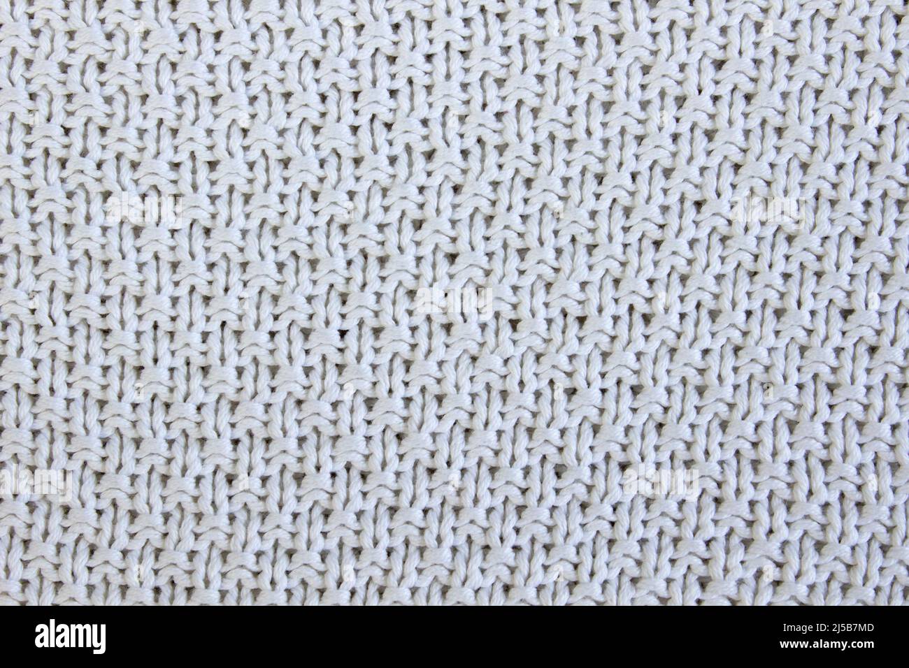 Soft light natural texture of knitted wool textile material background ...