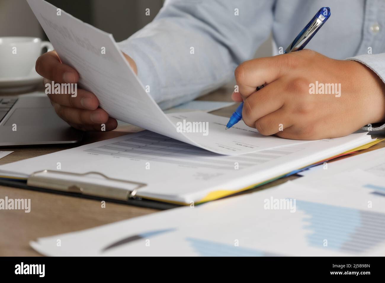 Man reading documents hand up hi-res stock photography and images - Alamy
