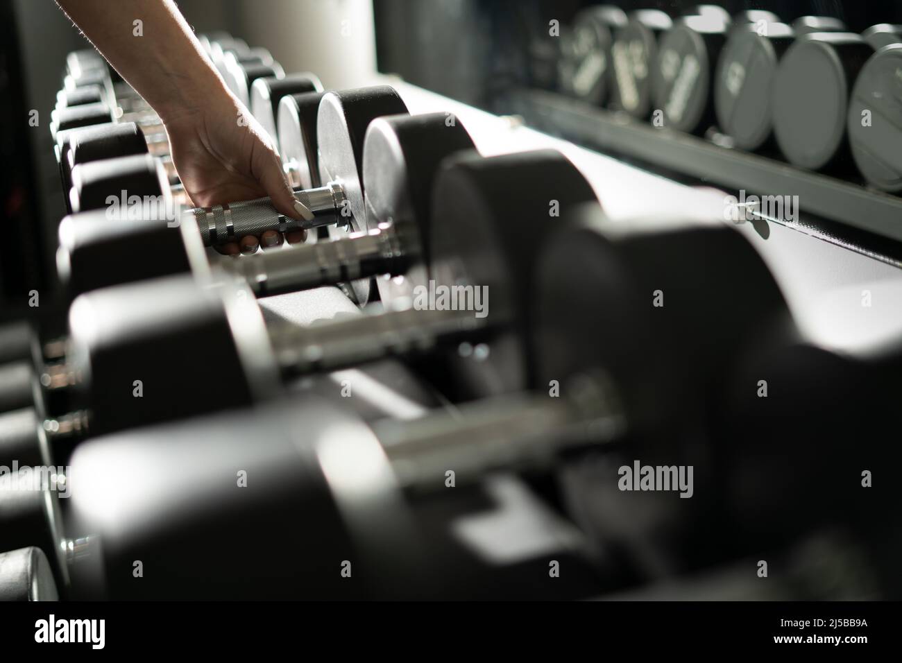 Holding a dumbbell in one hand hi-res stock photography and images - Alamy
