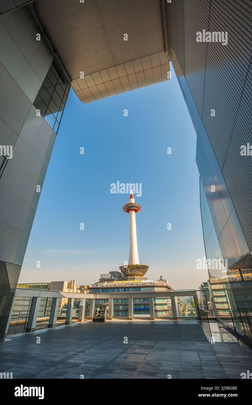 The Kyoto Tower, framed by the walls of the Kyoto Railway Station ...
