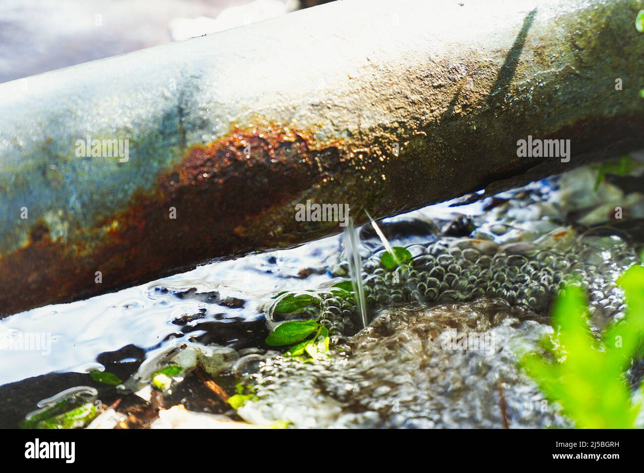Water leak or breakthrough rusty pipe Stock Photo - Alamy