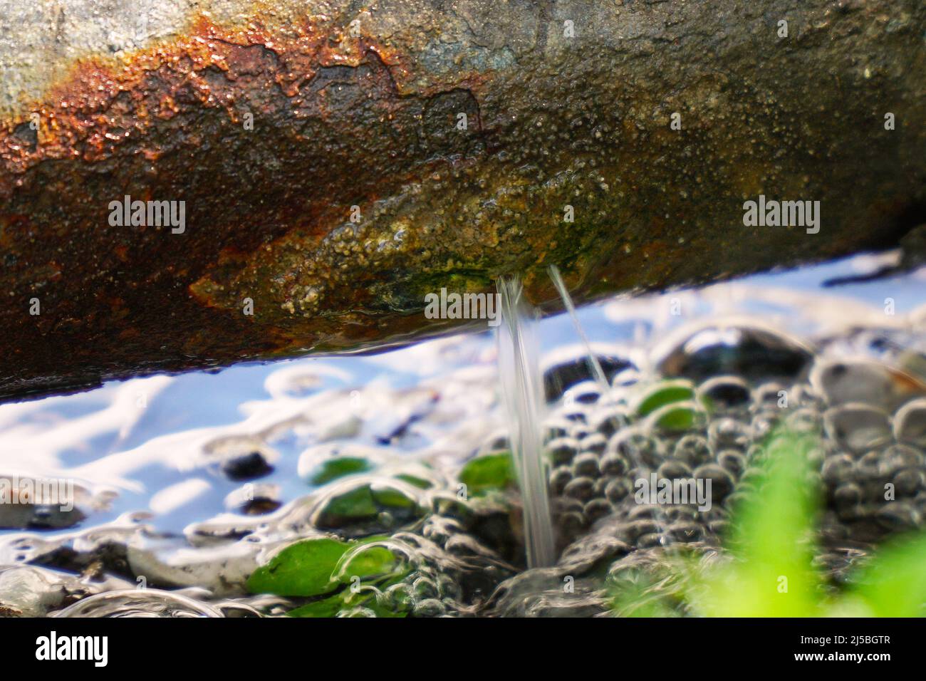 Water leak or breakthrough rusty pipe Stock Photo - Alamy
