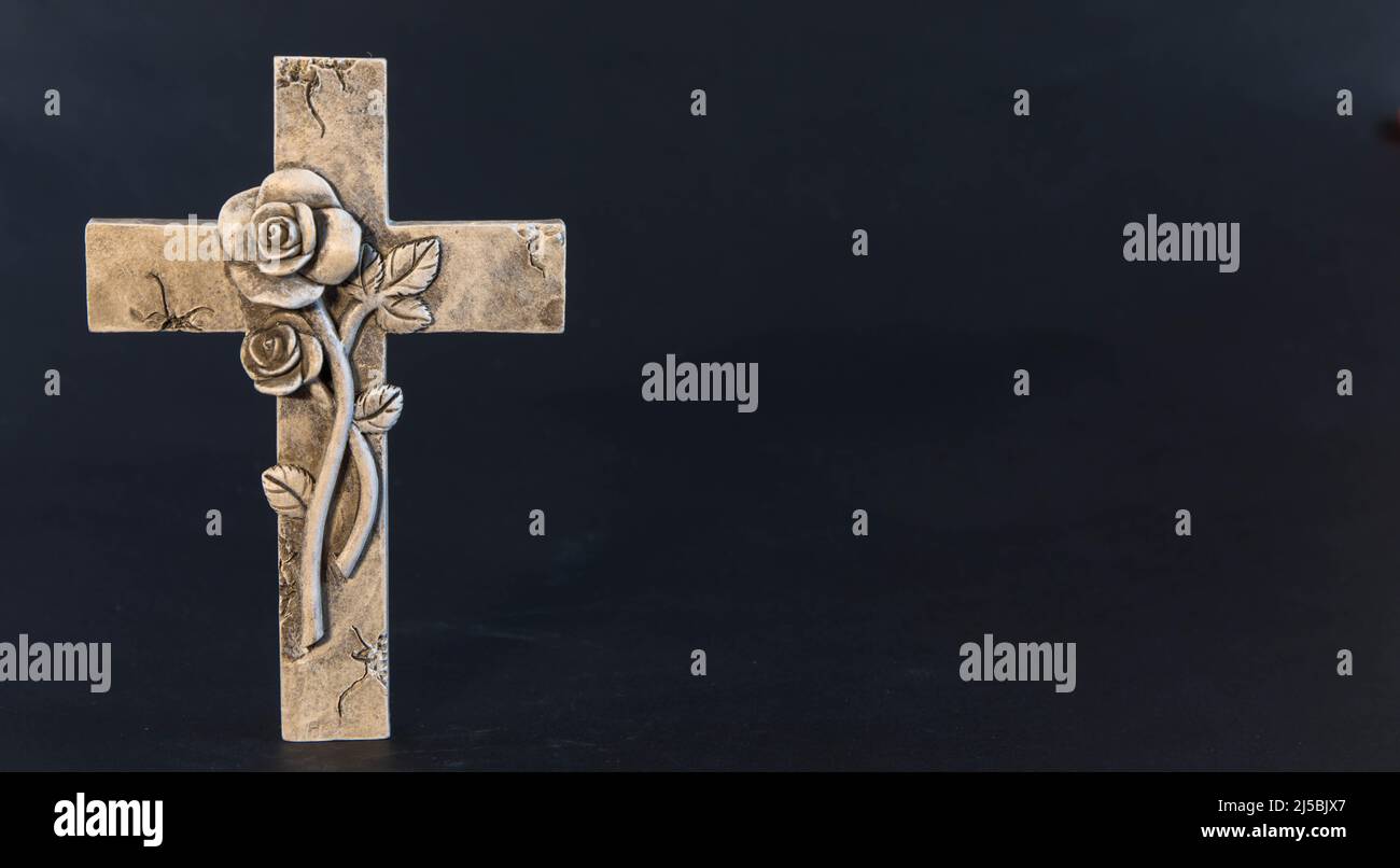 Isolated ornate religious cross with on a dark background. Moment of ...