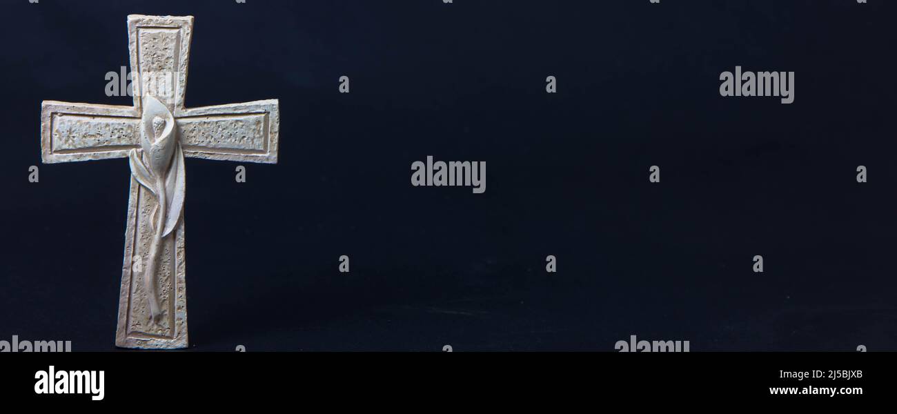 Isolated ornate religious cross with on a dark background. Moment of ...