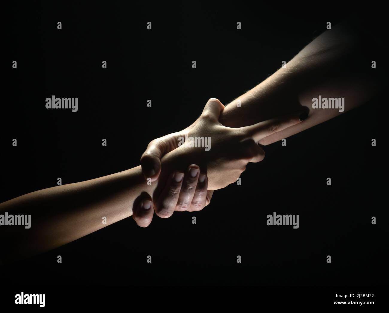 Two trength ands. Helping hand to a friend. Rescue or helping gesture ...