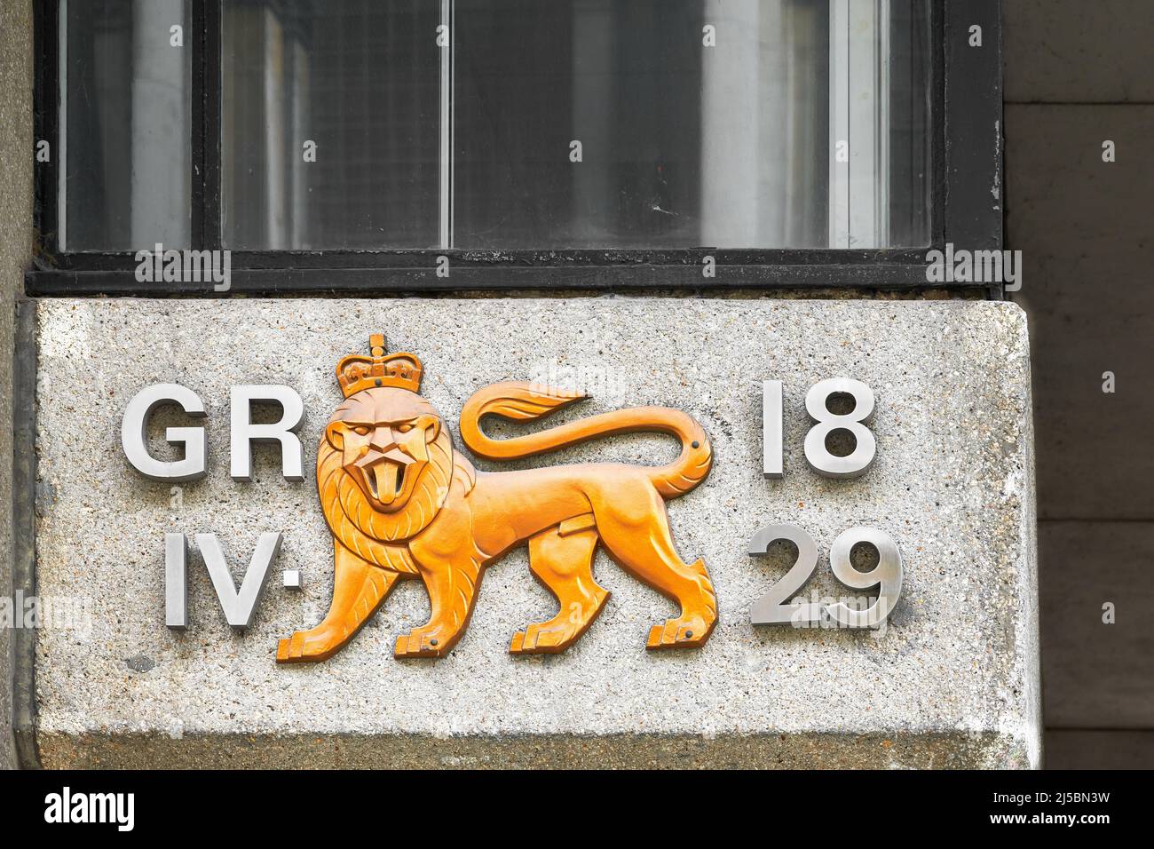 Emblem on a wall of the Strand campus of King's college, university of ...