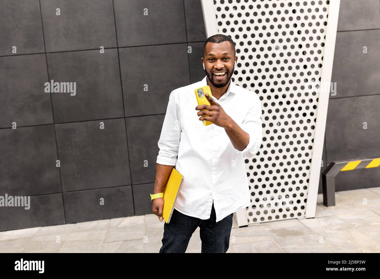 Happy male freelancer or student using tablet, received great news ...