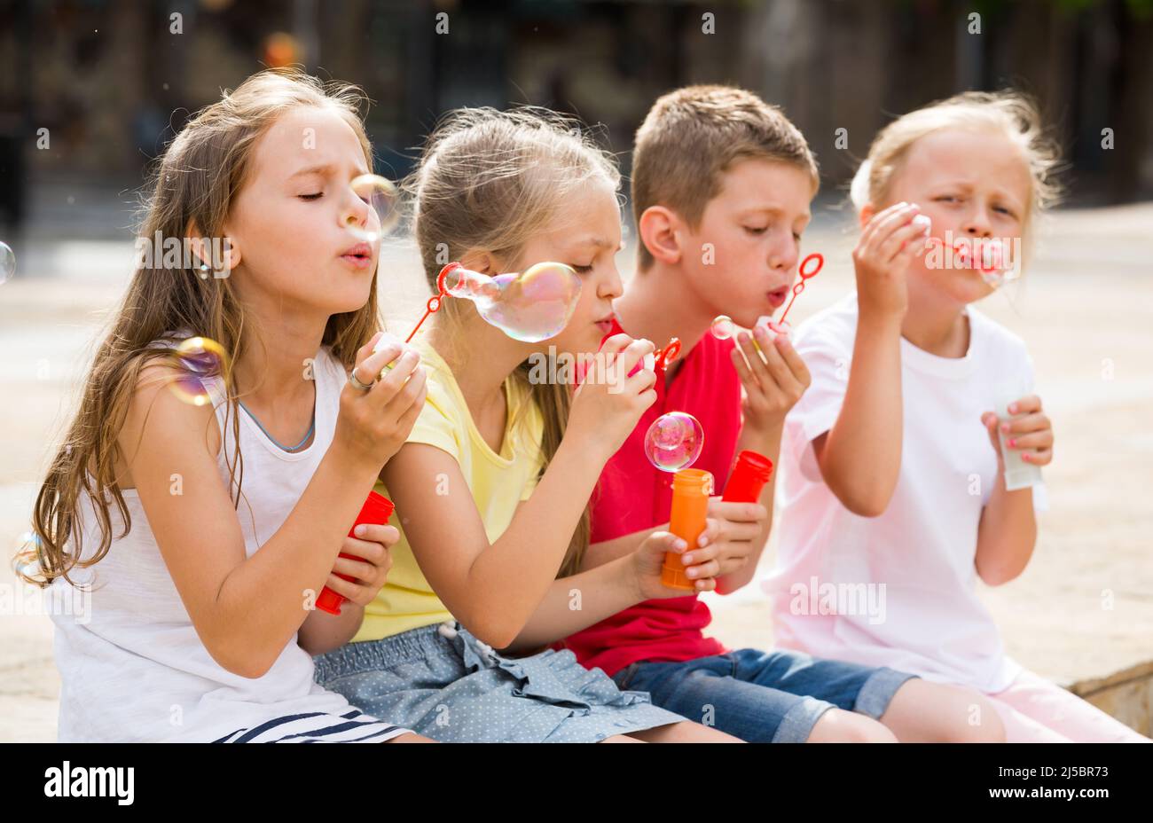 children blowing bubbles outdoors Stock Photo - Alamy