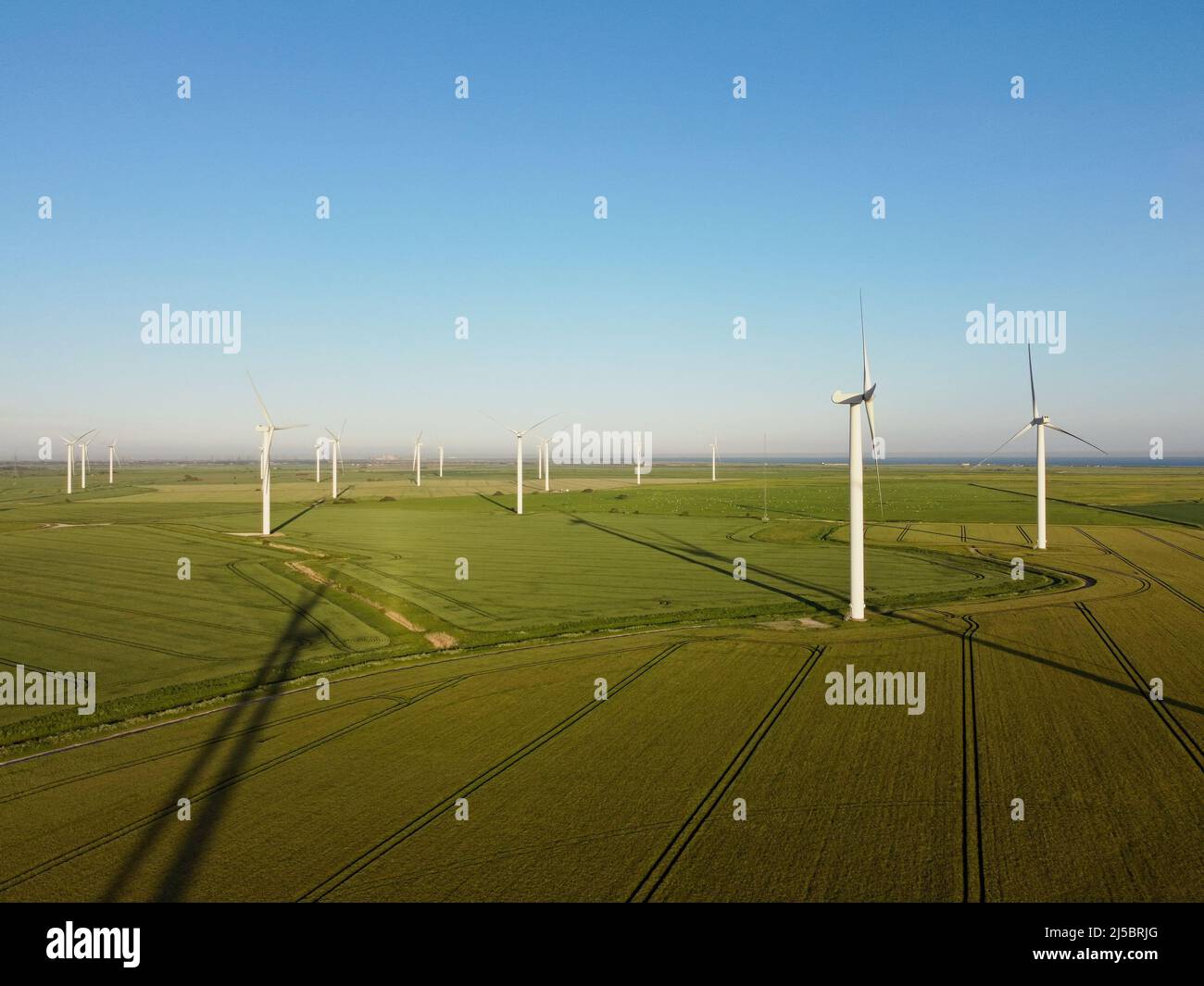 Aerial drone. Wind farm in the fields in south east England. Wind ...