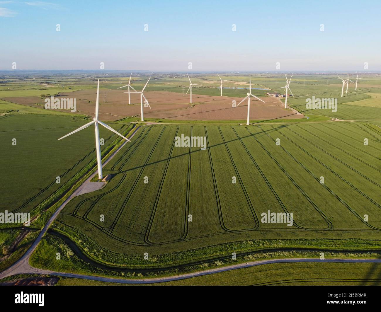 Aerial drone. Wind farm in the fields in south east England. Wind ...