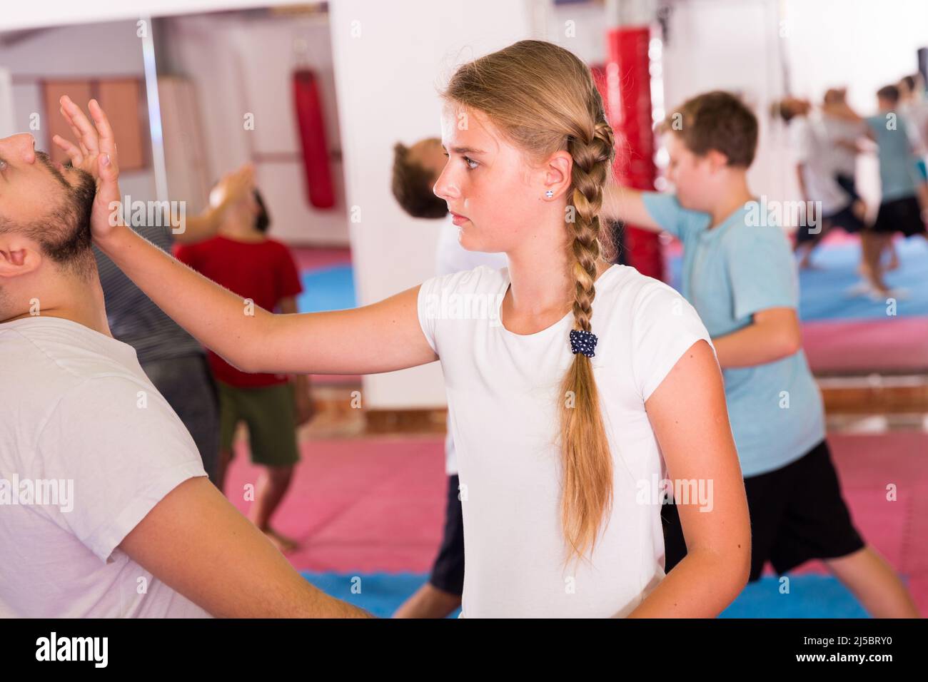 Kids exercising self-defense movements Stock Photo - Alamy