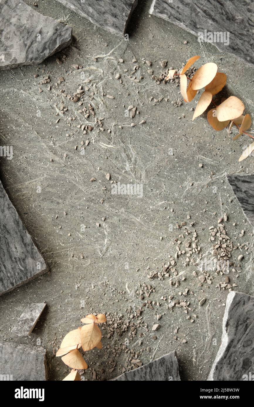 Layered flat stone background with broken pieces of granite plate, dry ...