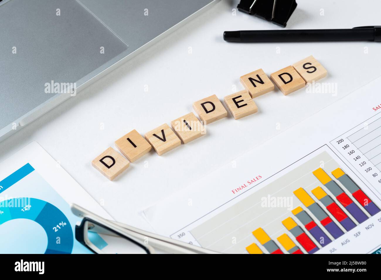 Dividends payment concept with letters Stock Photo - Alamy