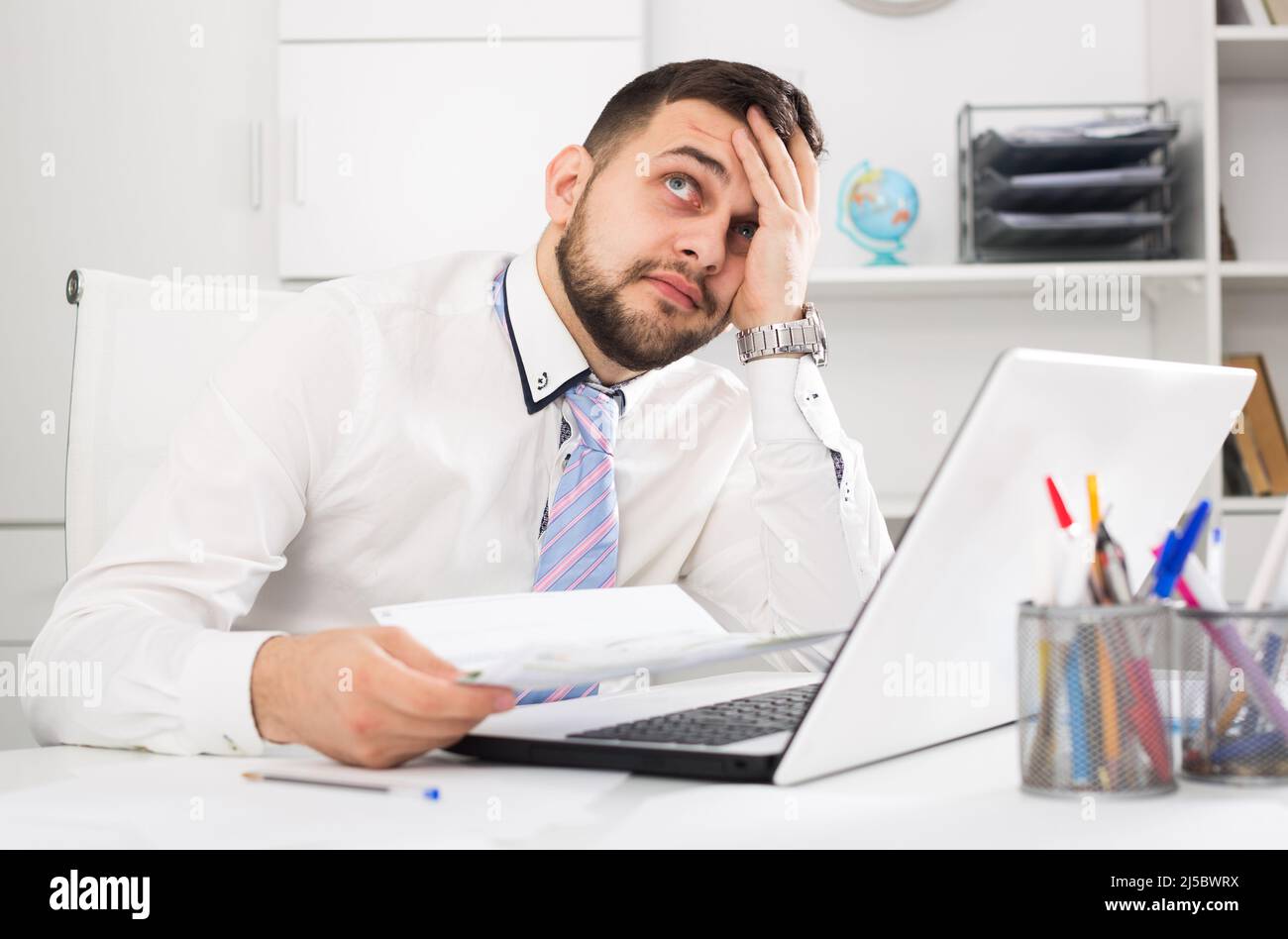 Man having problem in office Stock Photo - Alamy