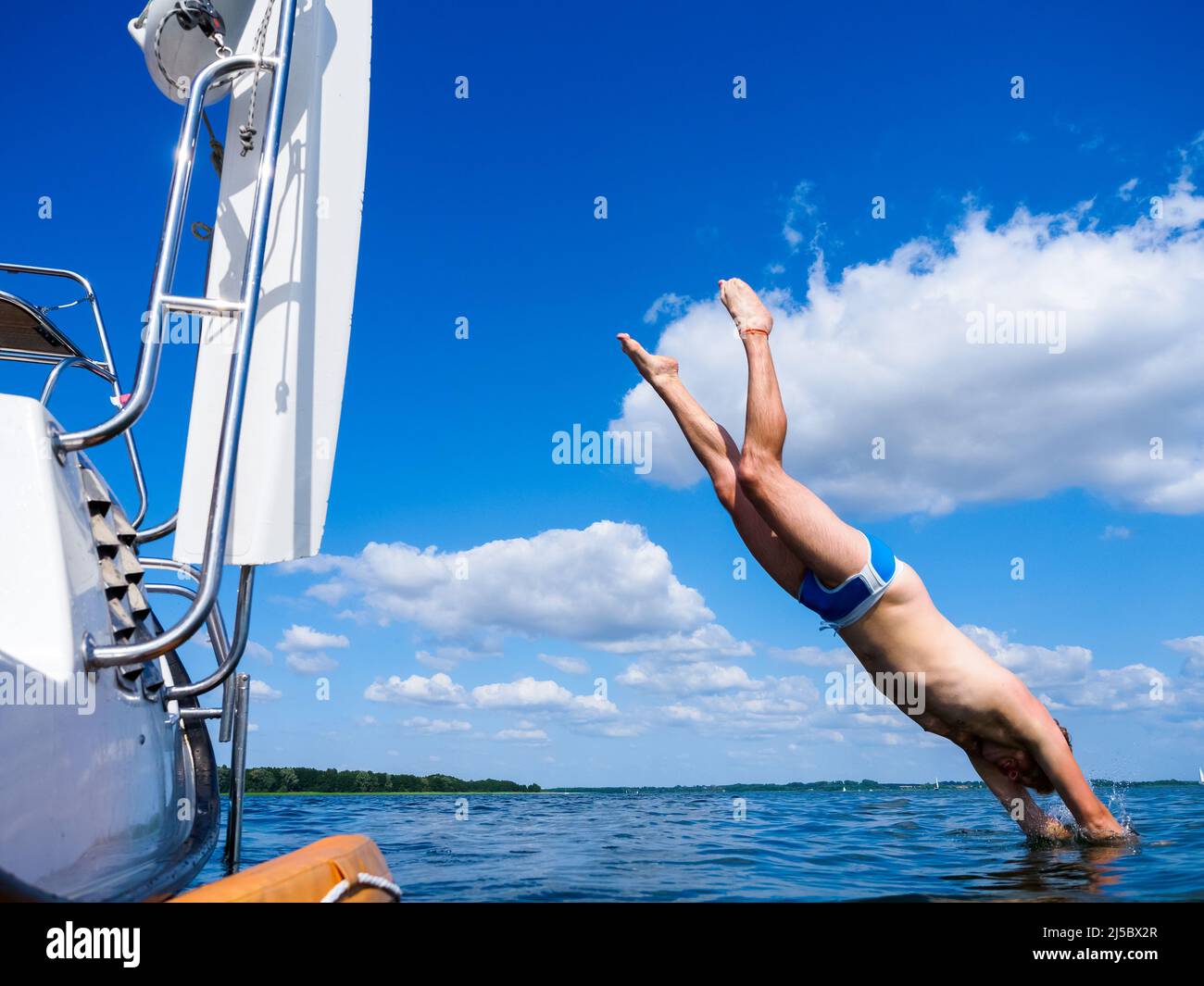 Jumping from yacht sea young hi-res stock photography and images - Alamy
